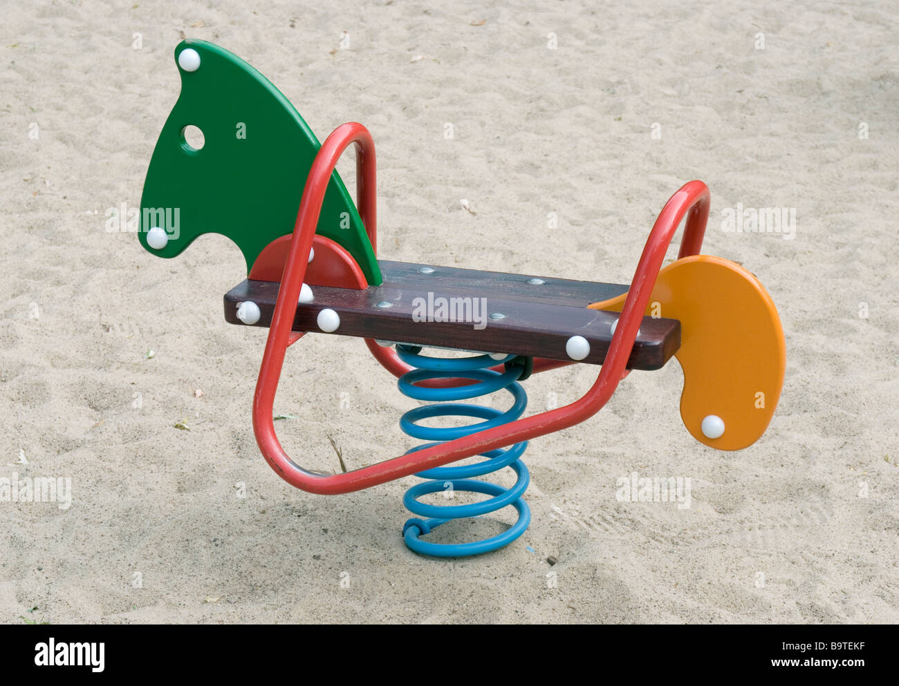 horse on a spring in a playground Stock Photo - Alamy