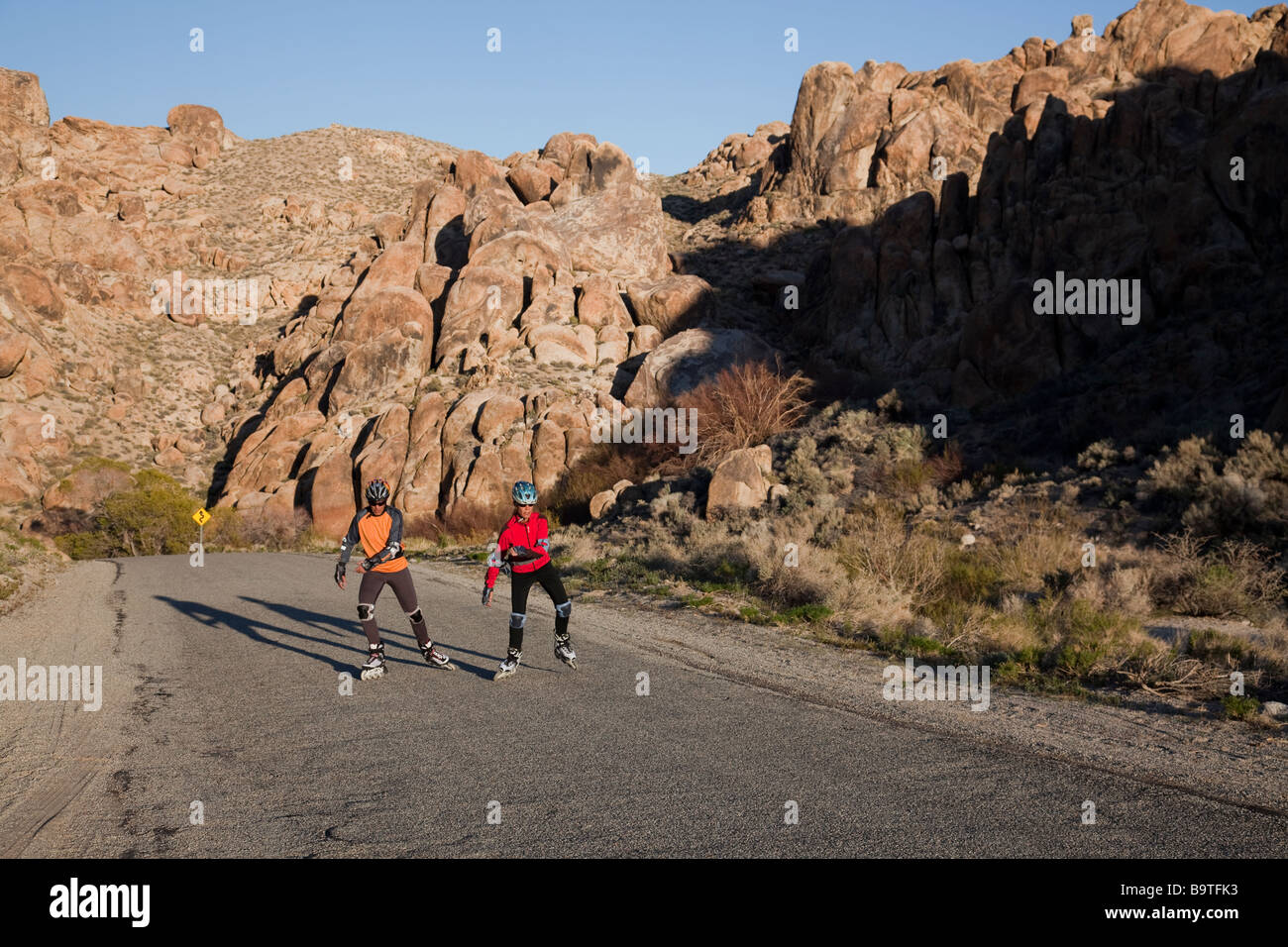 Couple roller blading Stock Photo - Alamy