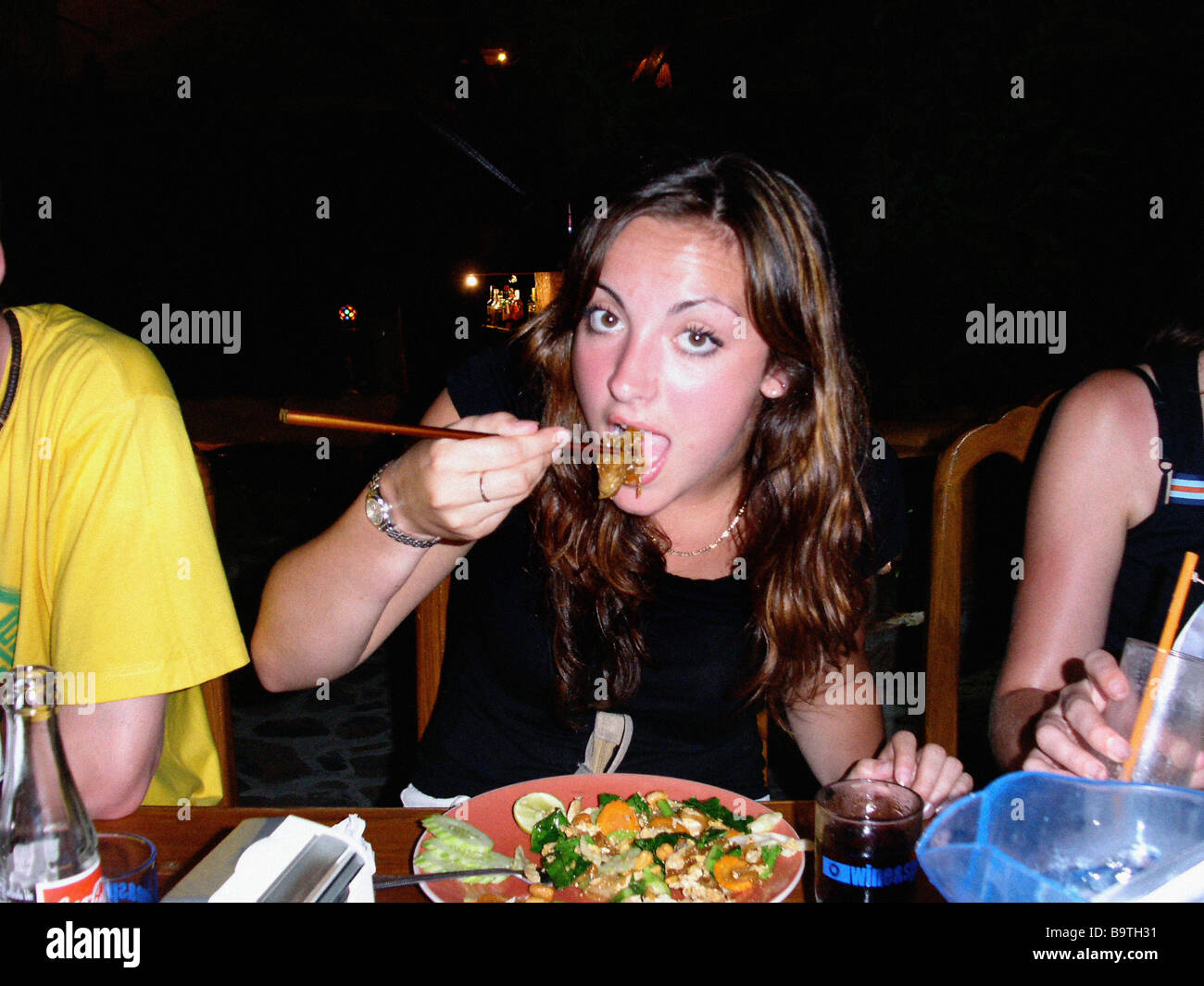 young woman eating thai food Stock Photo - Alamy
