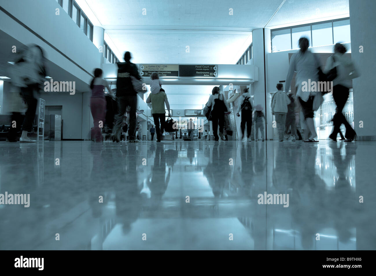 Departure area of airport with people moving to the gates Stock Photo ...