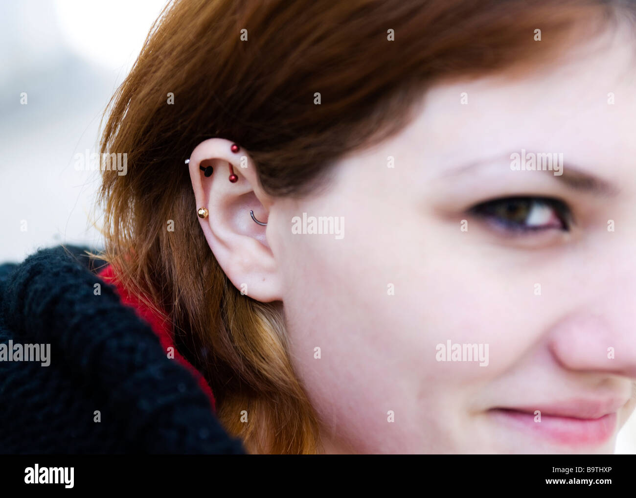 Young Caucasian female with ear piercings Stock Photo - Alamy