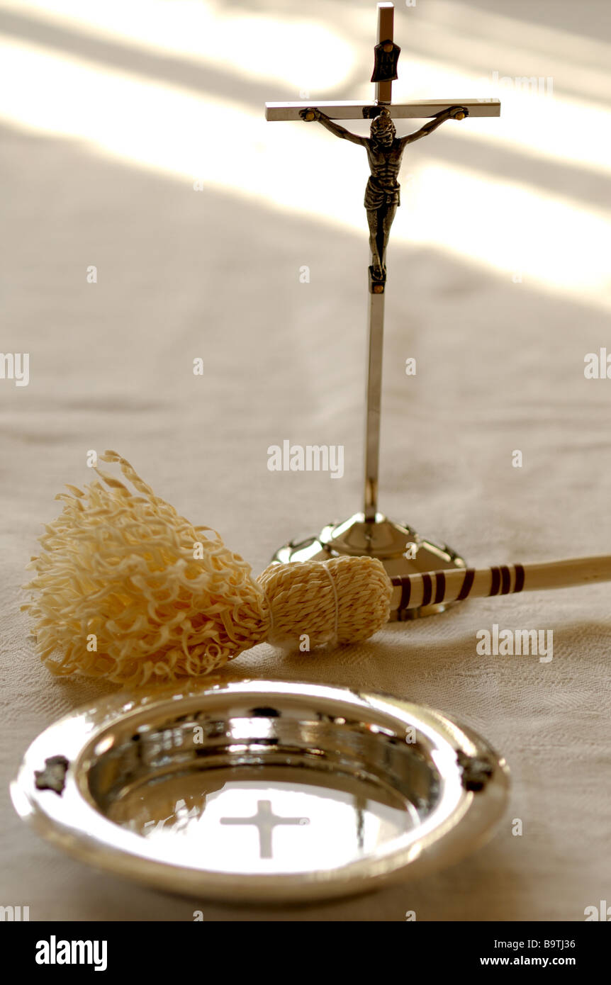 Christianity symbols cross holy water Stock Photo - Alamy
