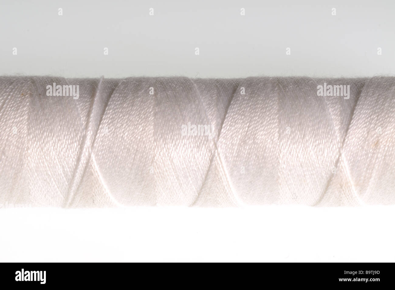 Closeup of a white clew of thread Stock Photo - Alamy