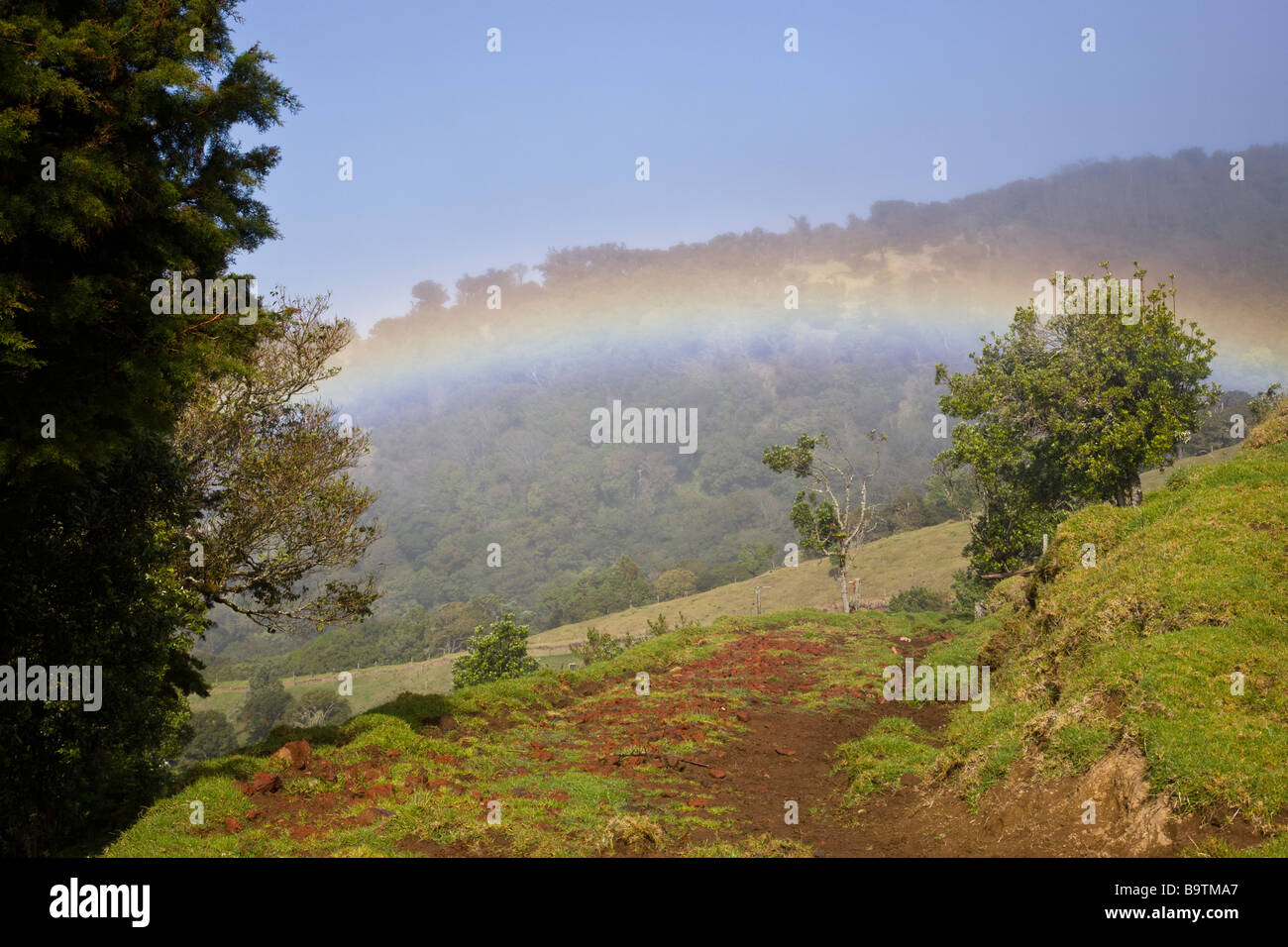 Rainbow after a downpour on the hillside of Costa Rica's Central Valley ...