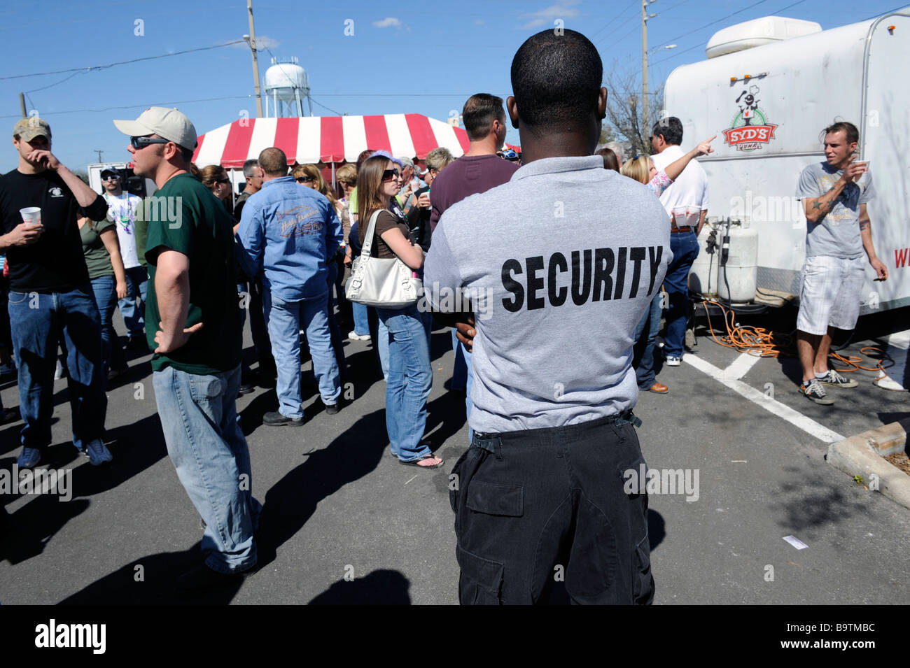 African American Male Security Guard controls crowd at Lake Wales Mardi ...