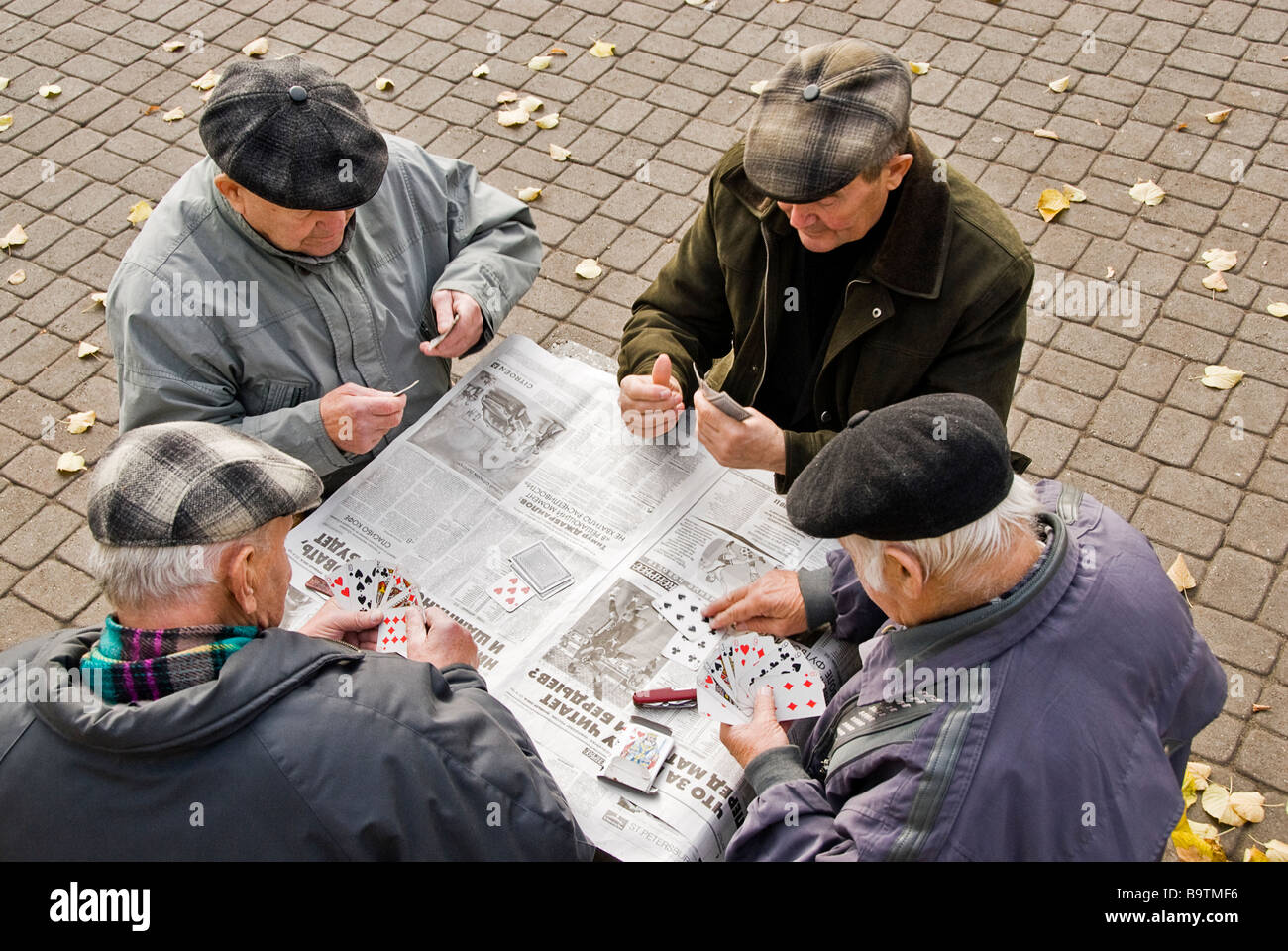 Group of old men playing cards in Wohrmann´s Garden, Riga, Latvia ...