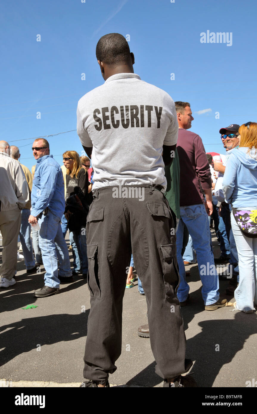 African American Male Security Guard controls crowd at Lake Wales Mardi ...
