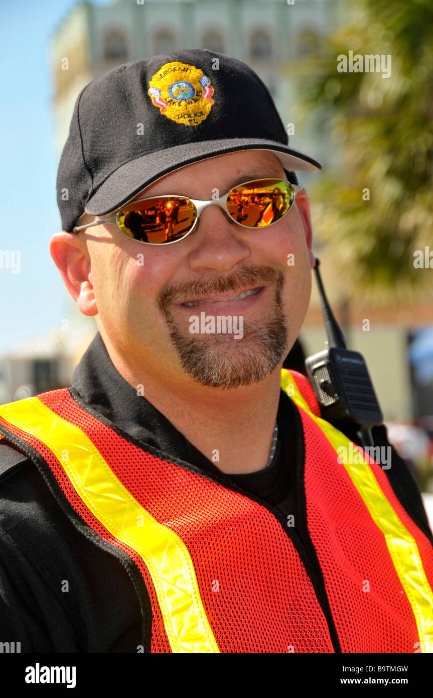 White Male Police Officer Manages Crowd at Lake Wales Mardi Gras ...