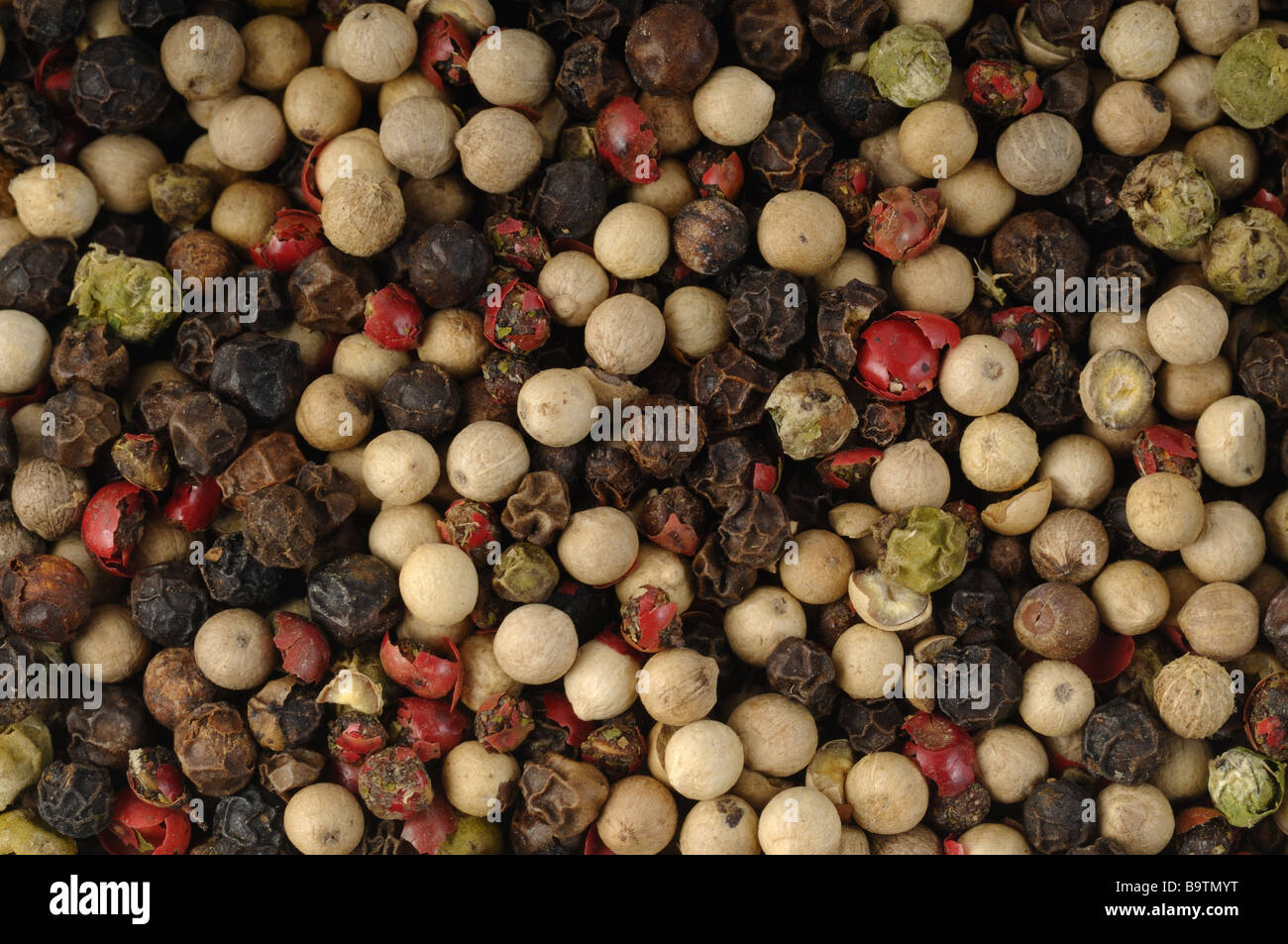 Closeup view of mixed peppercorns Stock Photo - Alamy
