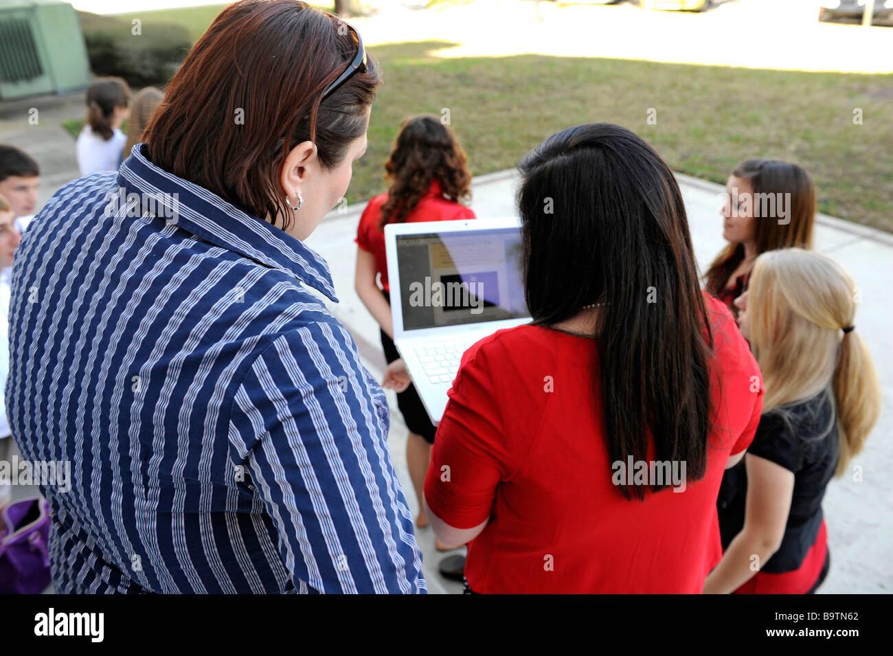 Students on field trip work on laptop computers Stock Photo - Alamy