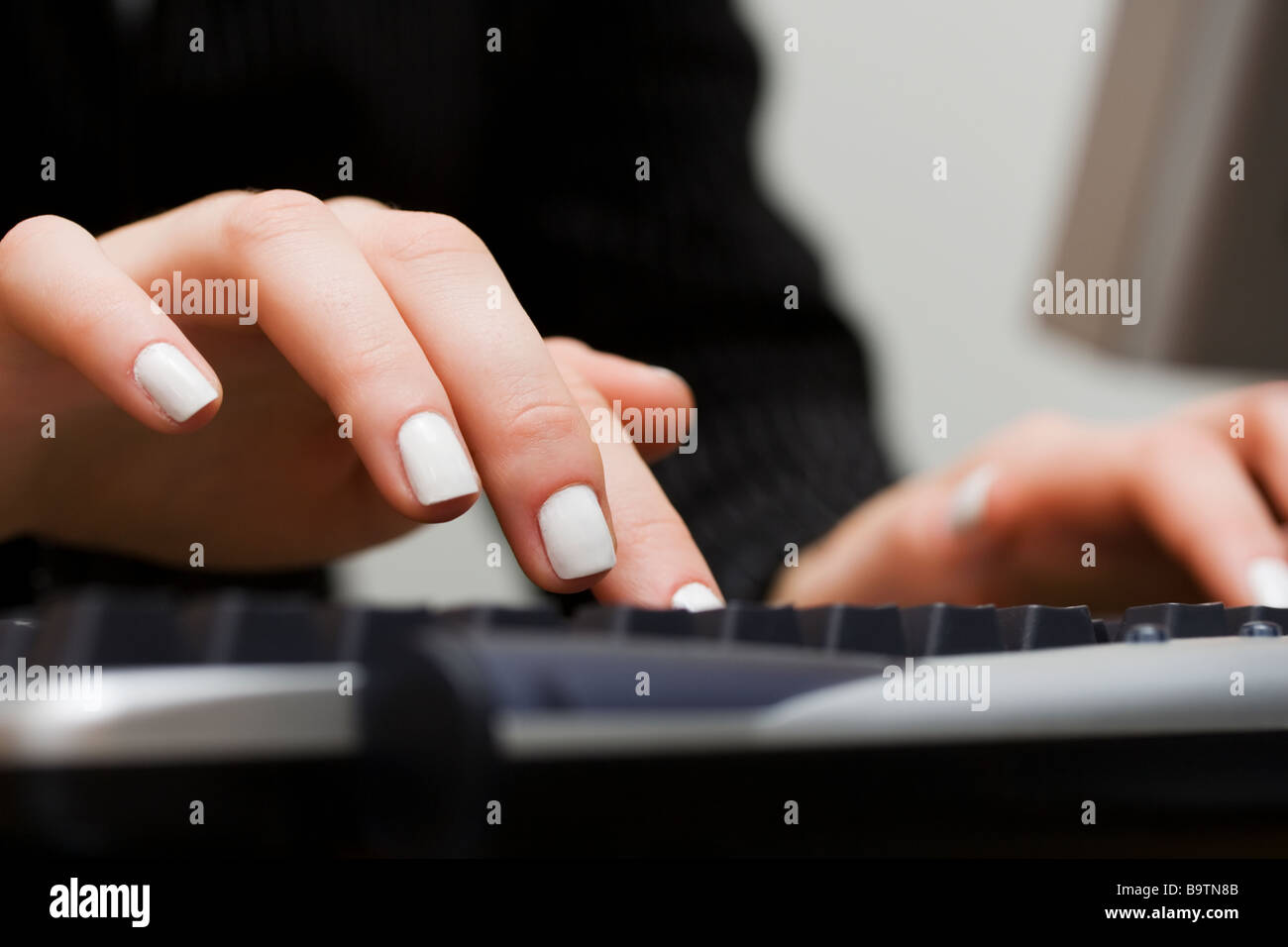 Female hands using computer keyboard Stock Photo - Alamy