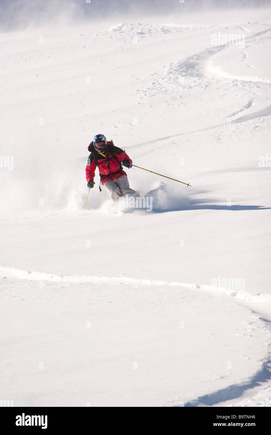 Man skiing in the backcountry at Hot Dog Bowl and making fresh tracks ...