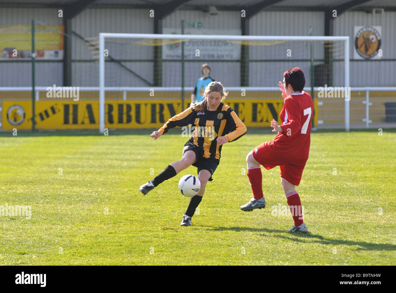 Girls playing football match uk hi-res stock photography and images - Alamy