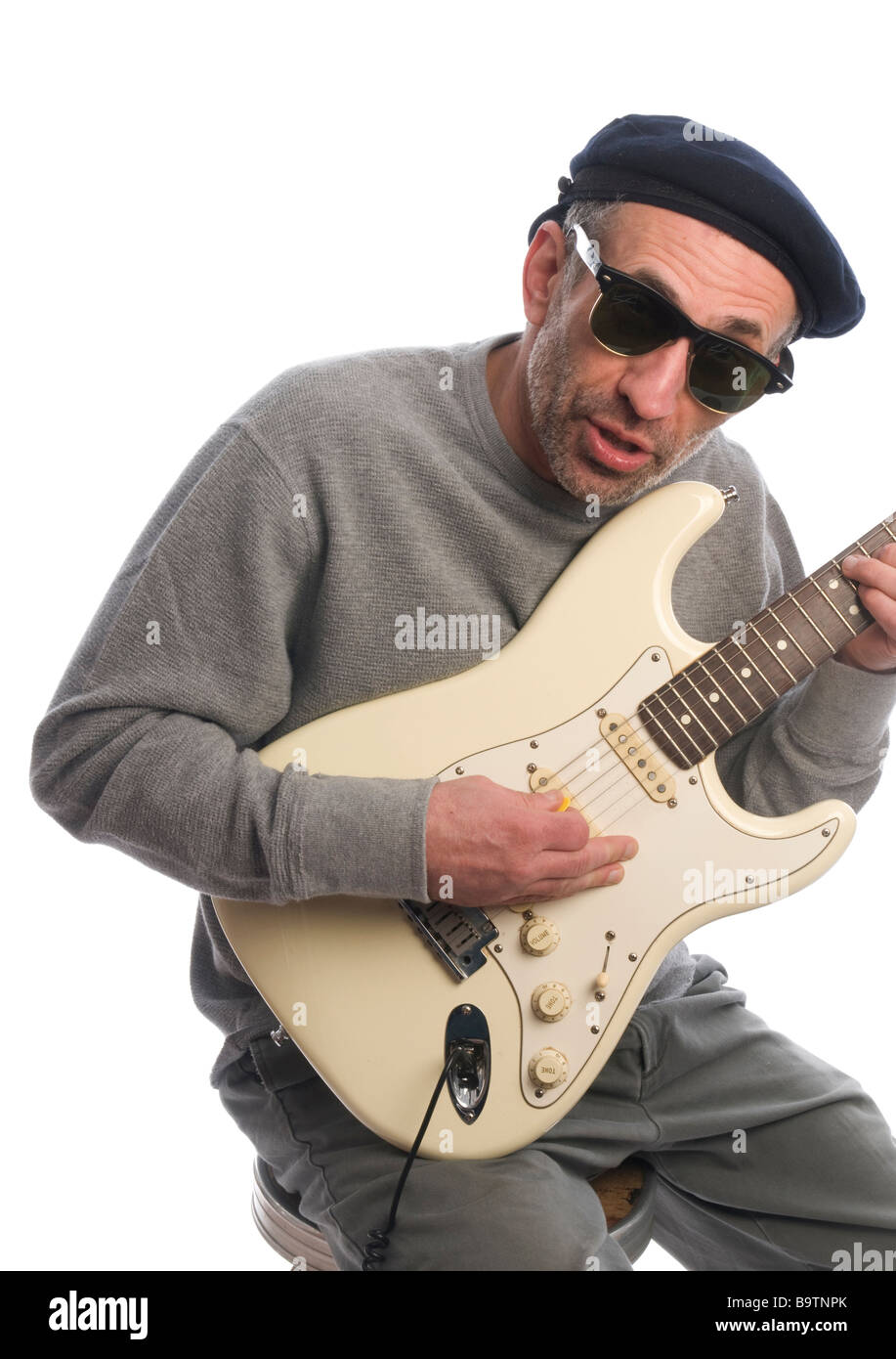 aging baby boomer old senior man musician playing guitar french beret ...