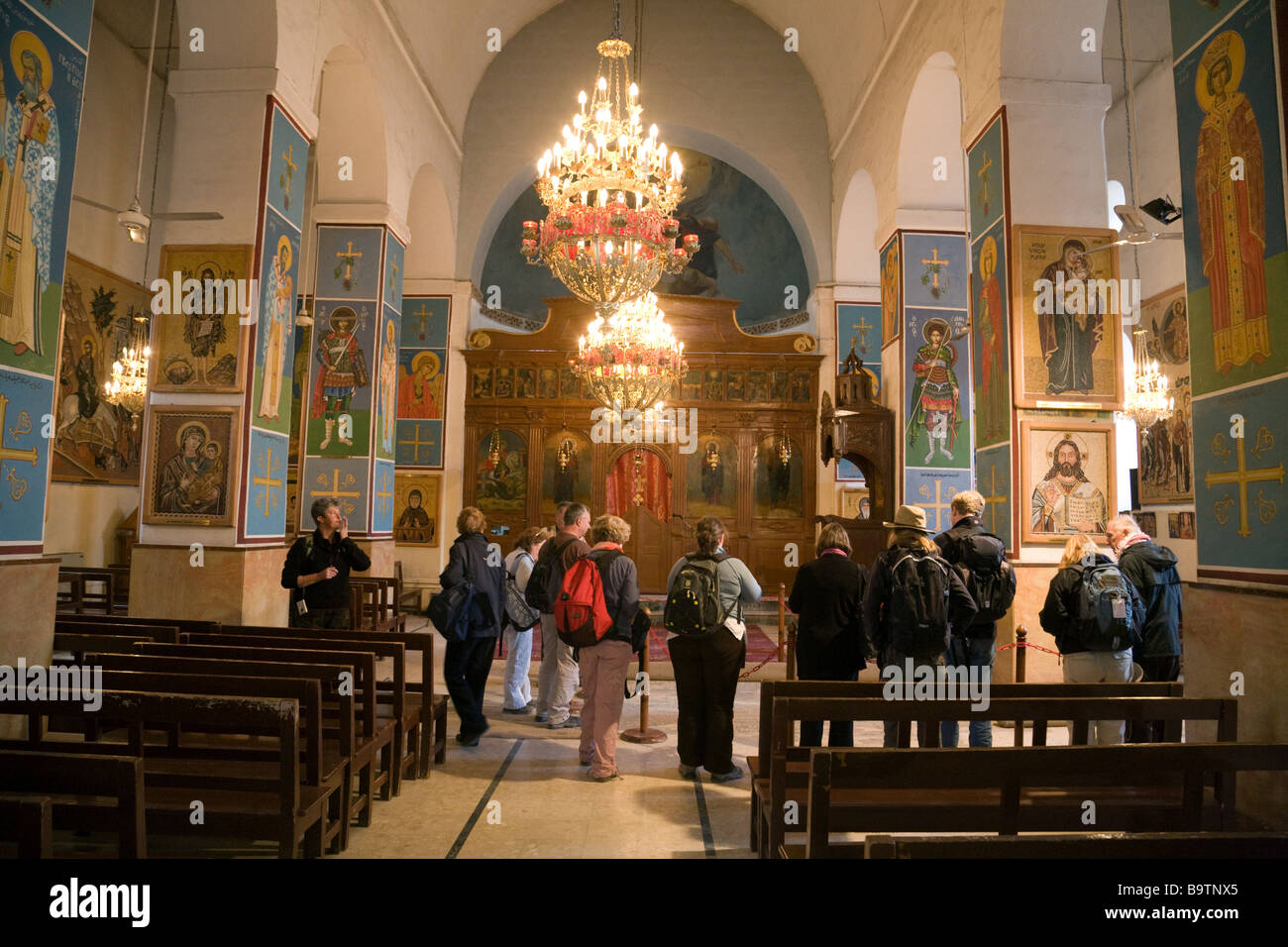 Tourists inside St George Church, Madaba, Jordan Stock Photo - Alamy