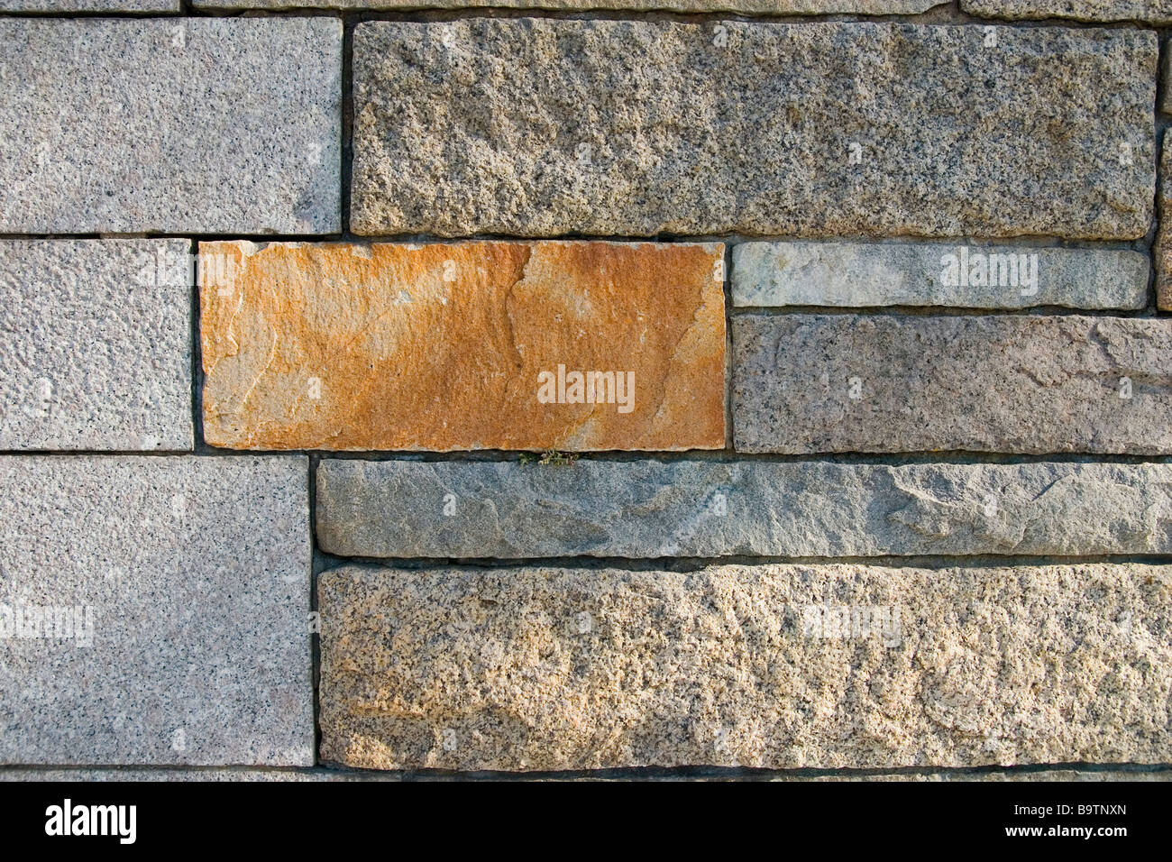 Supportive stone wall as a background Stock Photo - Alamy