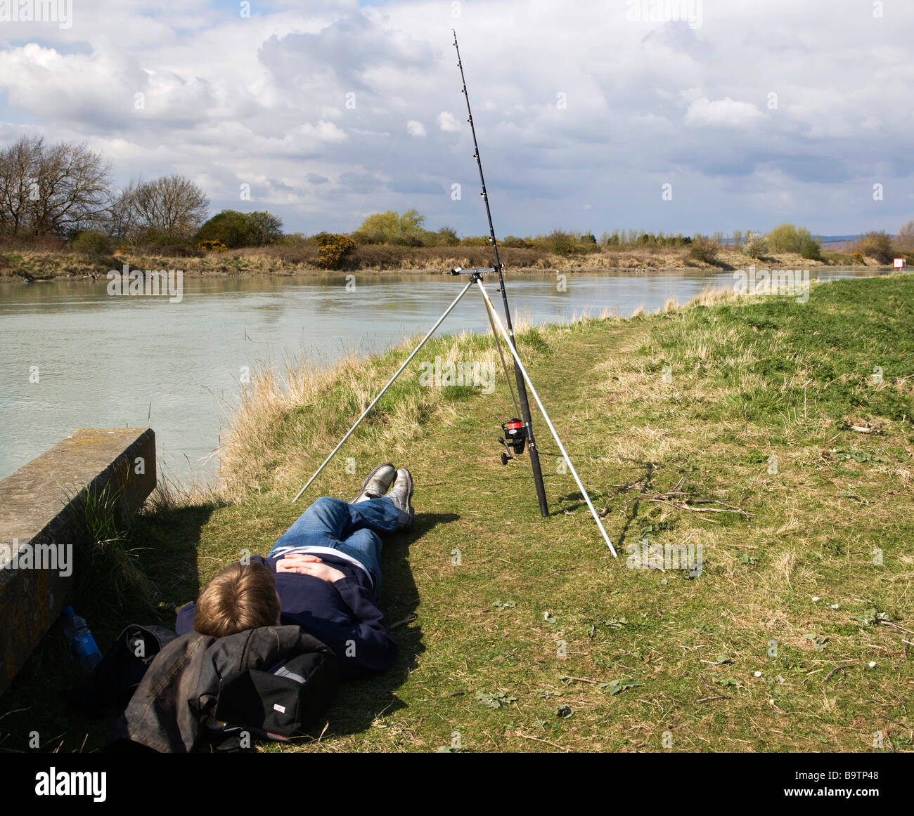 An Angler Asleep by his Rod Stock Photo - Alamy