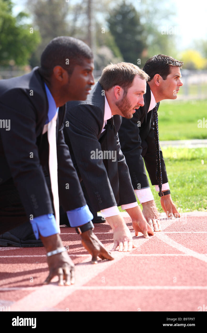 Businessmen lined up at starting line Stock Photo - Alamy