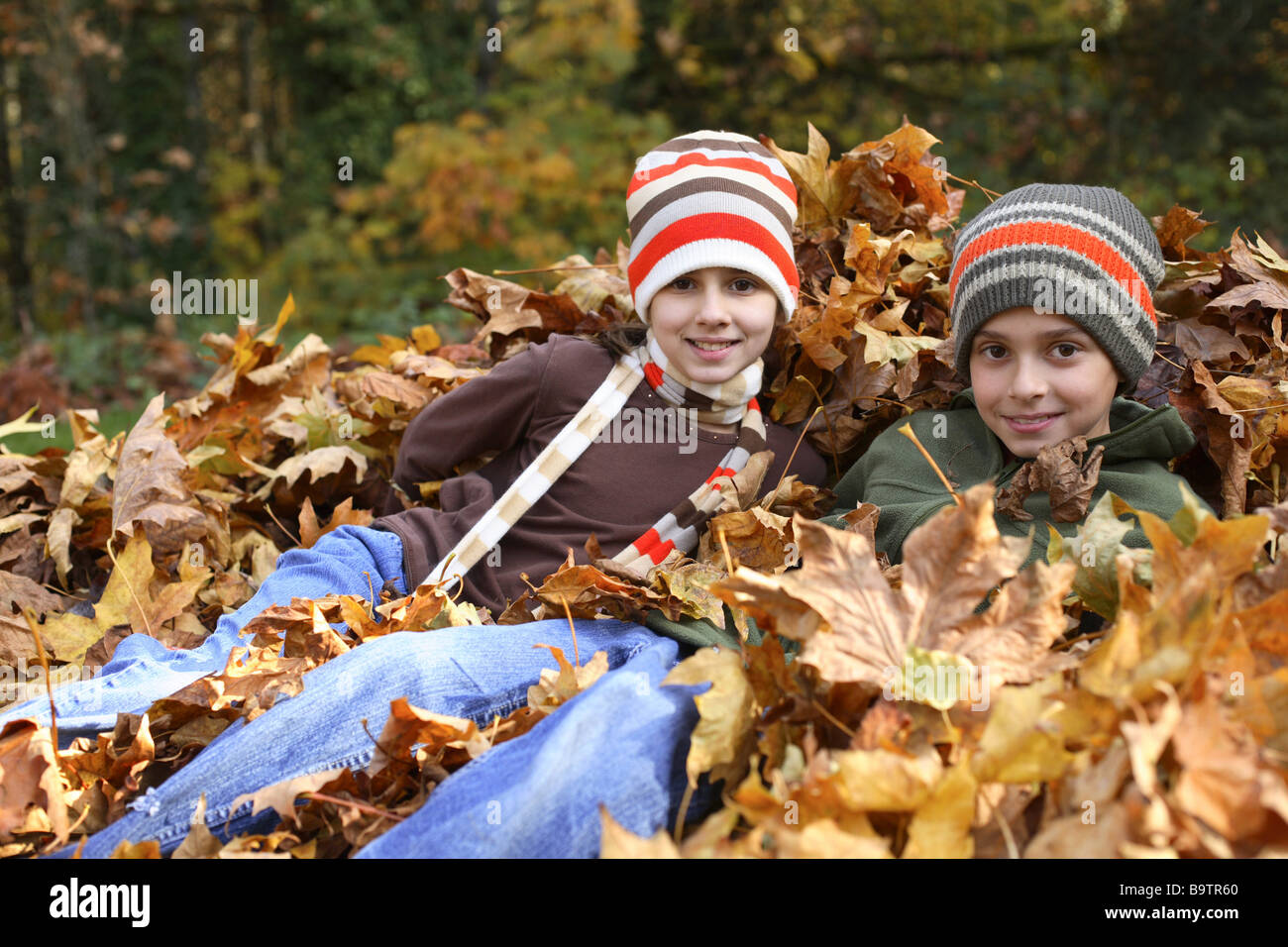 Children playing in pile leaves hi-res stock photography and images - Alamy