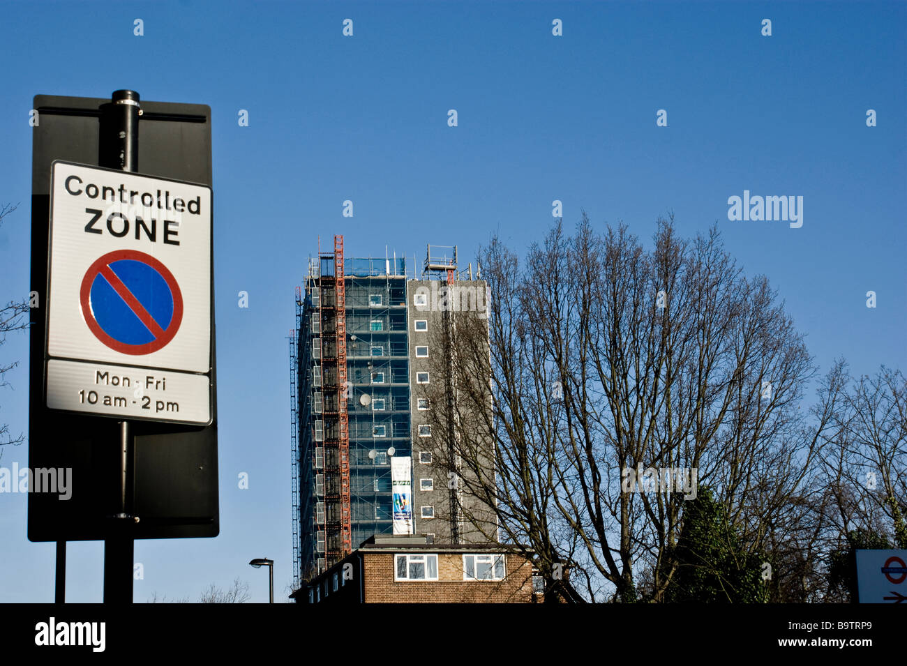 Ubiquitous London 'controlled Parking sign' with council block 'Ilex ...