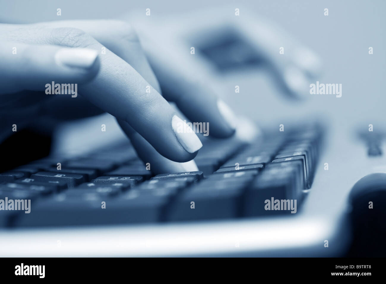 Female hands using computer keyboard Stock Photo - Alamy