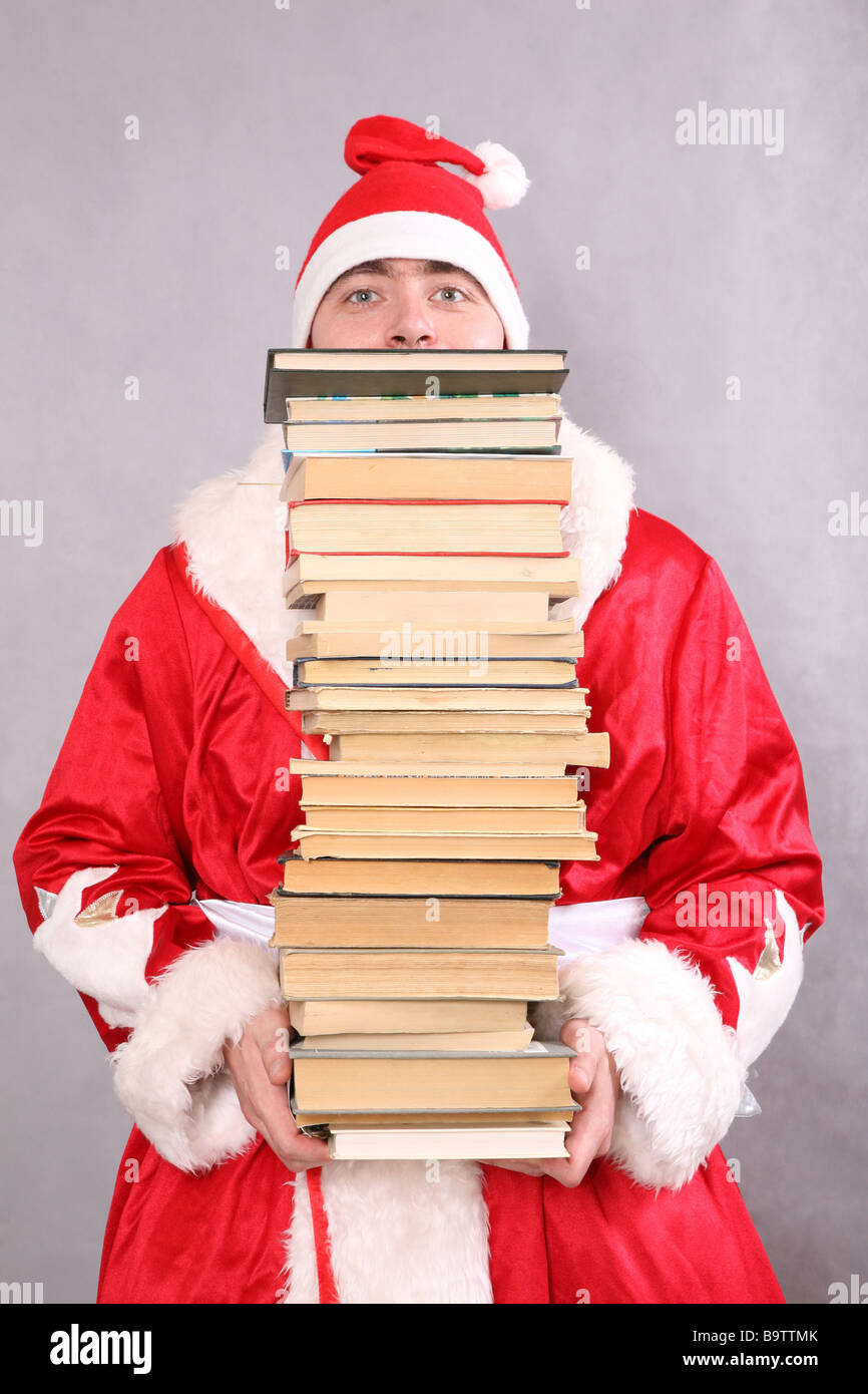 Santa claus holding book hi-res stock photography and images - Alamy