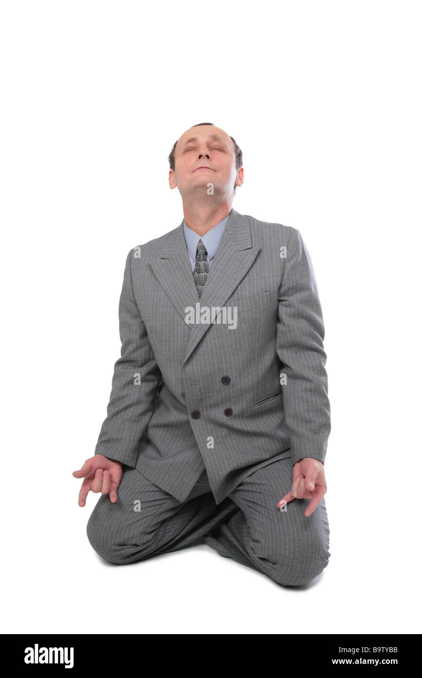 Meditating senior man sitting Cut Out Stock Images & Pictures - Alamy
