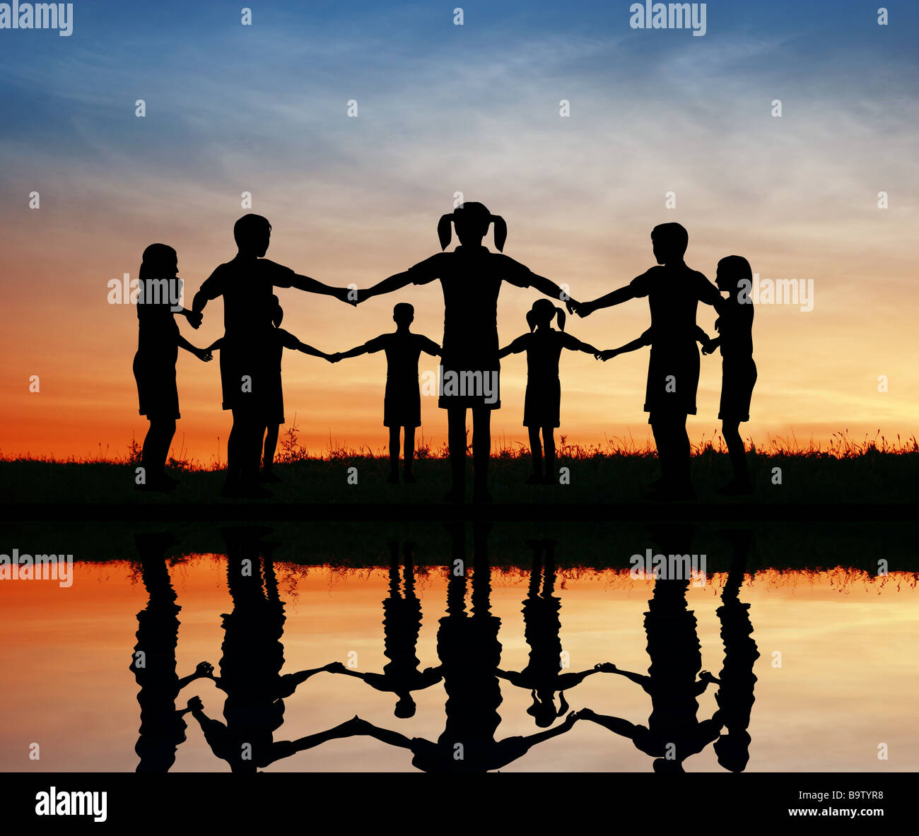 silhouette children. sunset pond Stock Photo - Alamy