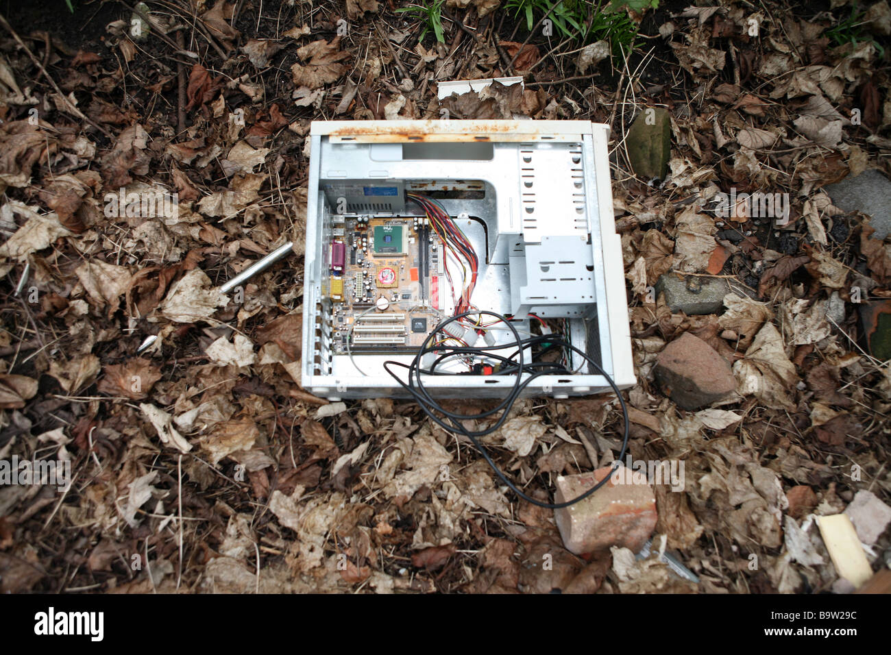 fly tipping discarded computer in woodland Stock Photo - Alamy