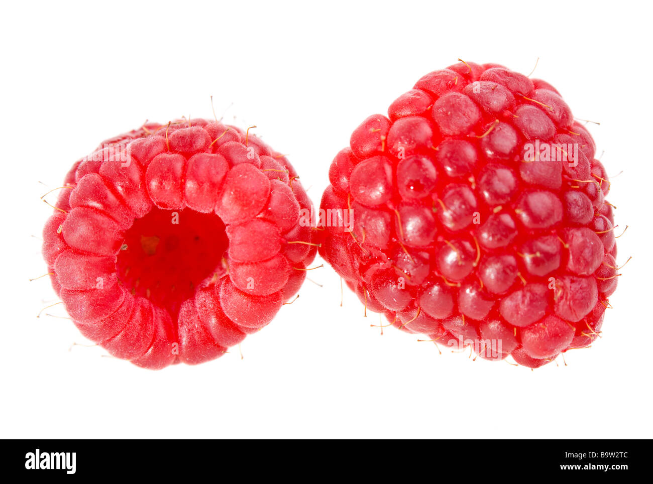 two large raspberry isolated on white background Stock Photo - Alamy