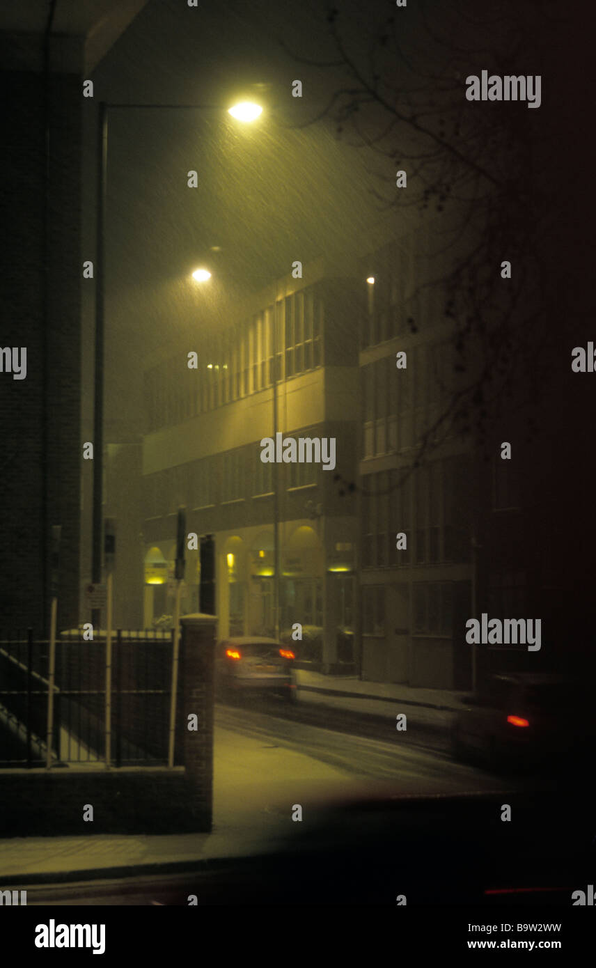Falling snow in dark street hi-res stock photography and images - Alamy