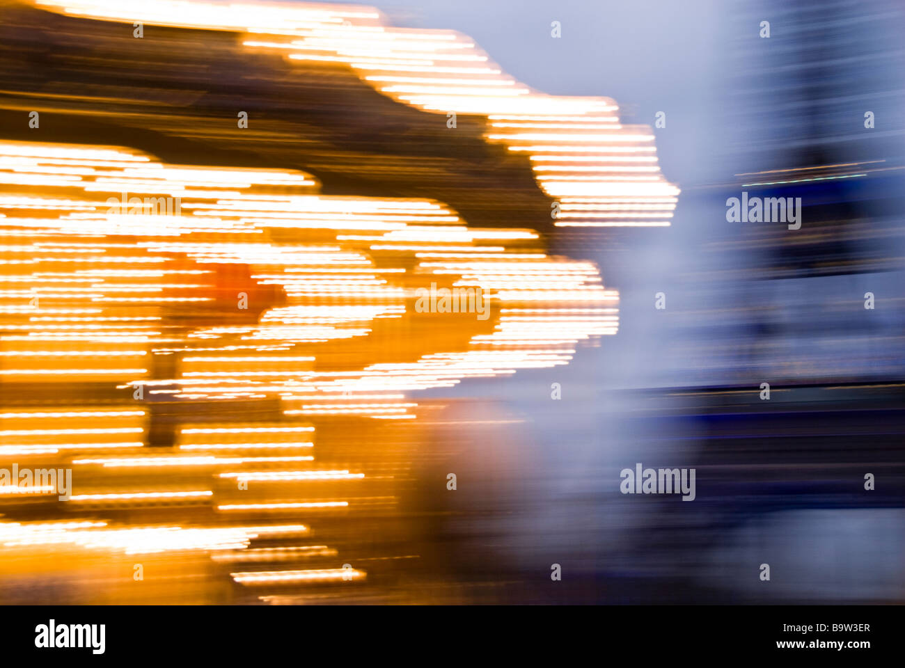 Blurred picture of a carousel and the Eiffel tower at dusk, Paris ...