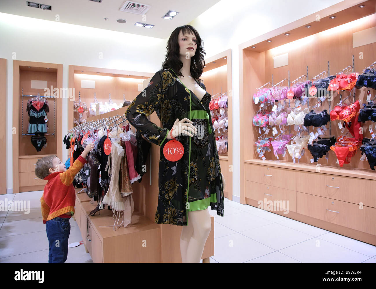 little girl in department of women`s linen Stock Photo - Alamy