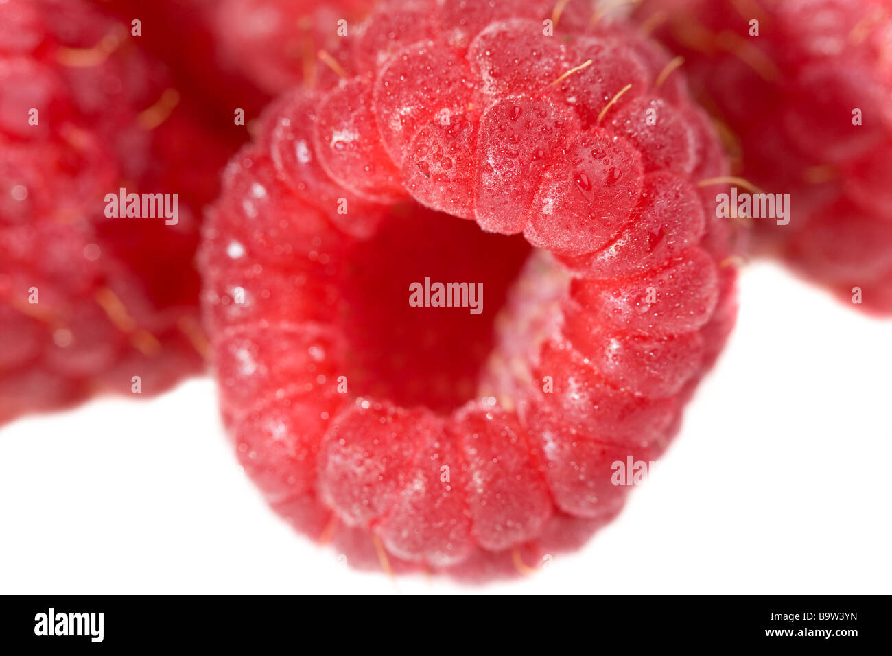 pile of raspberry with water drops macro Stock Photo - Alamy