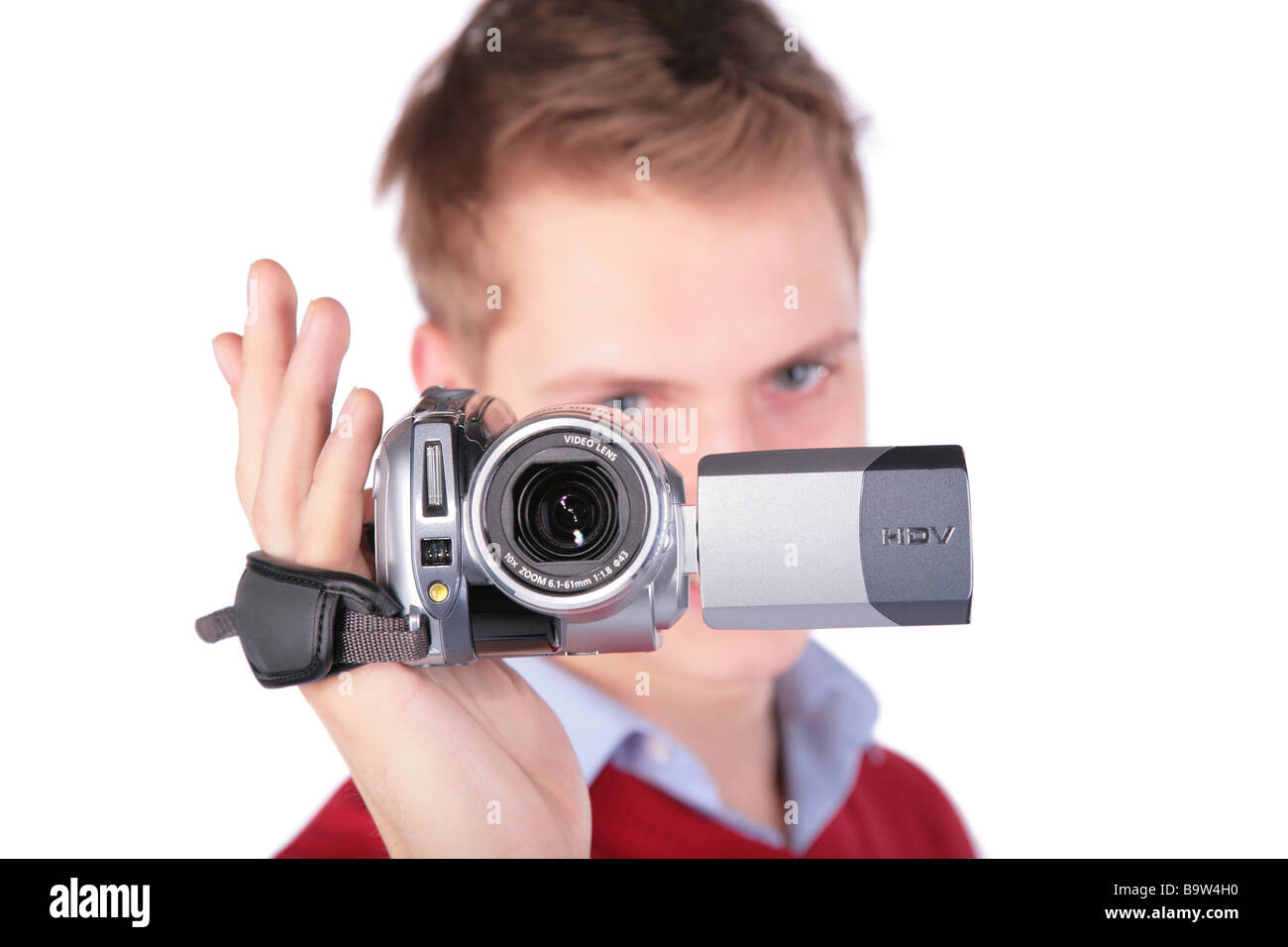 Boy in red jacket with HDV camera Stock Photo - Alamy