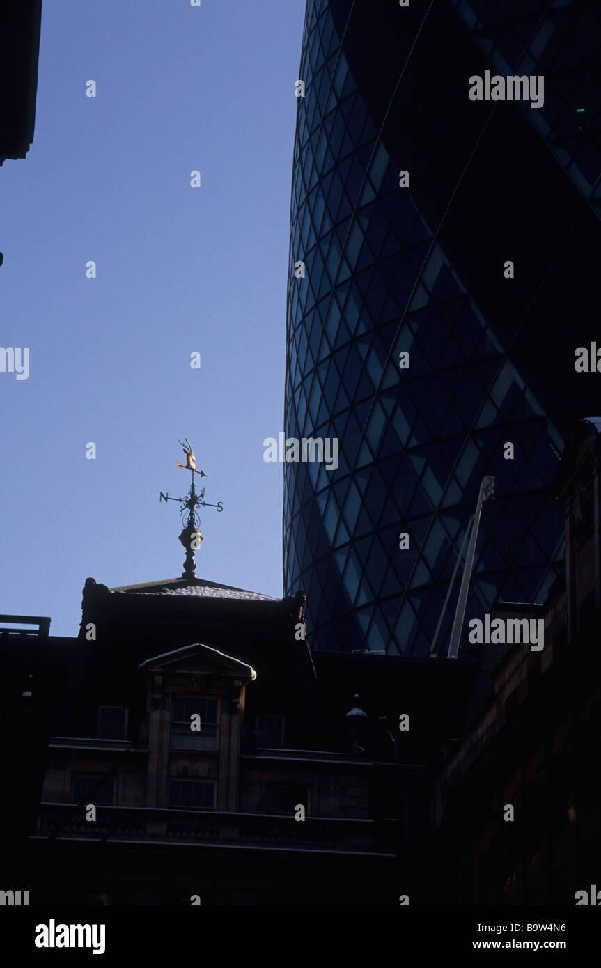 Gherkin appearing from behind ancient buildings of St Helens Place ...