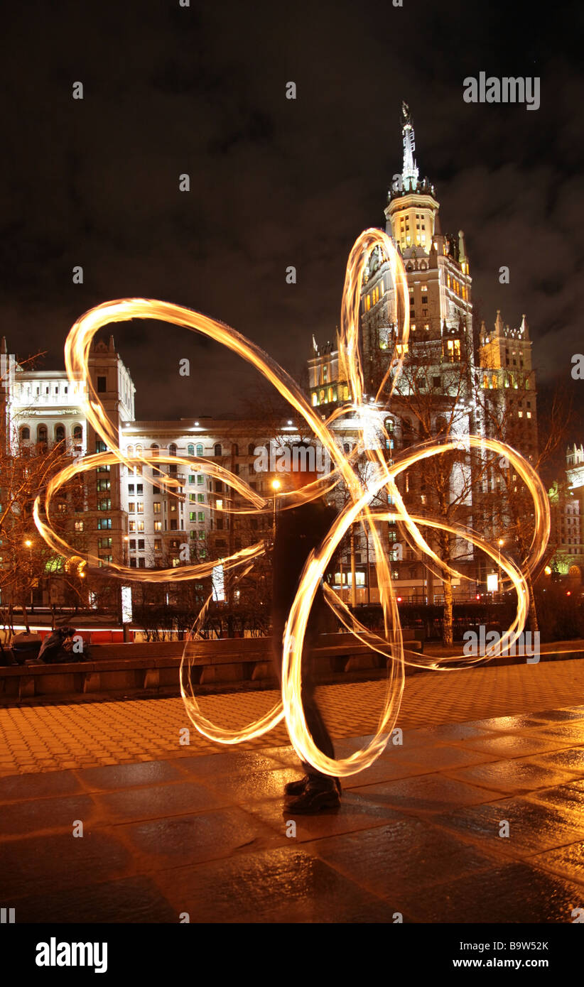 Person with moving light on street Stock Photo - Alamy