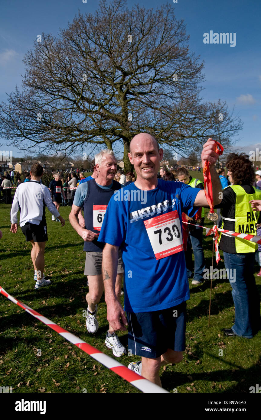 Long Distance runner with medal for competing in the Dronfield 10K fun ...