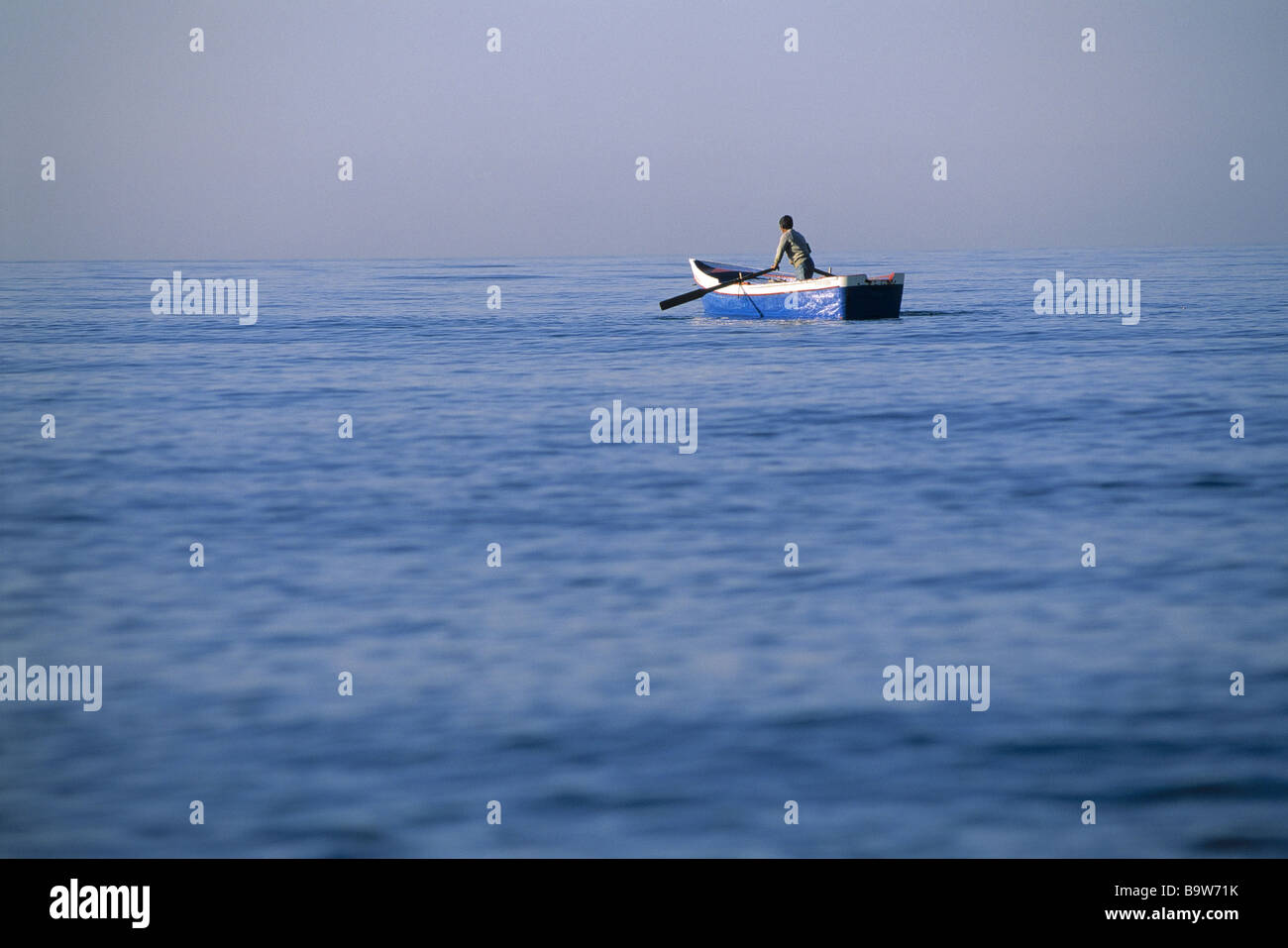 Man rowing boat distance hi-res stock photography and images - Alamy