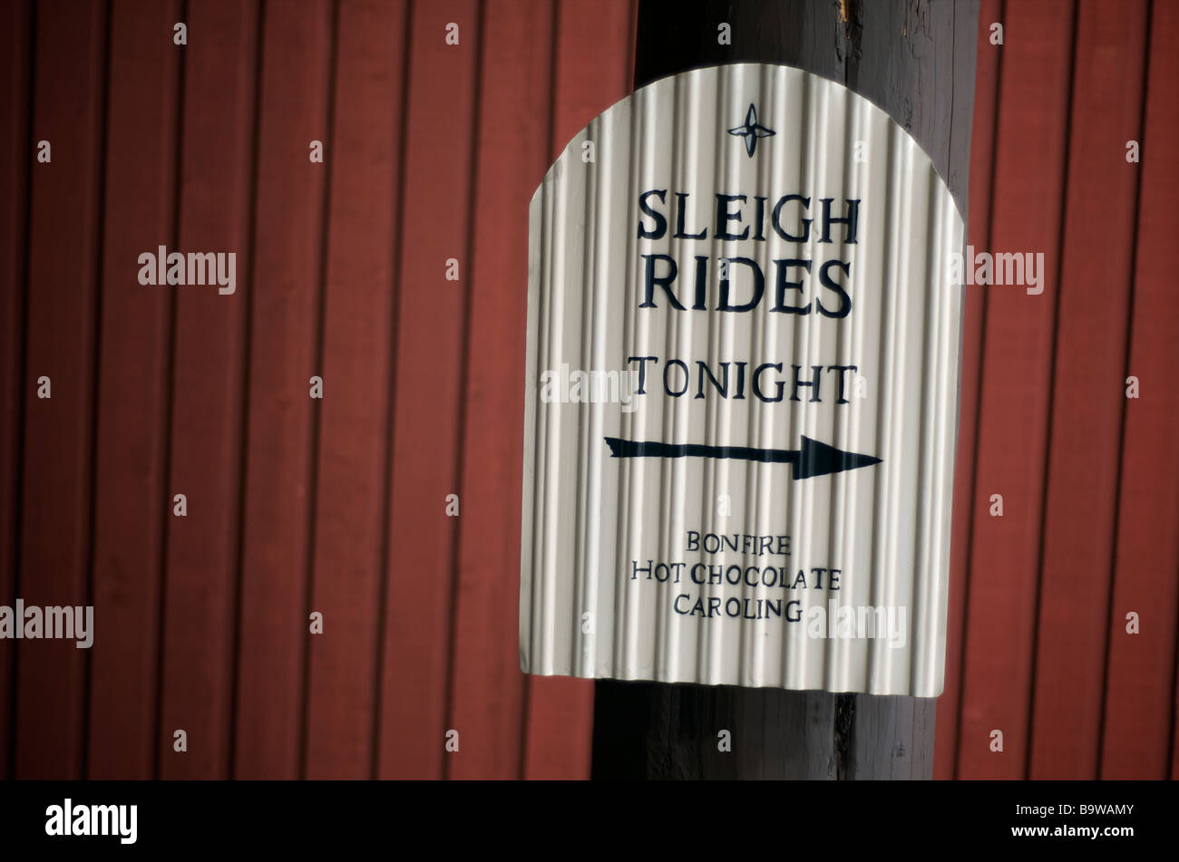 Handmade sleigh ride sign on pole Stock Photo - Alamy