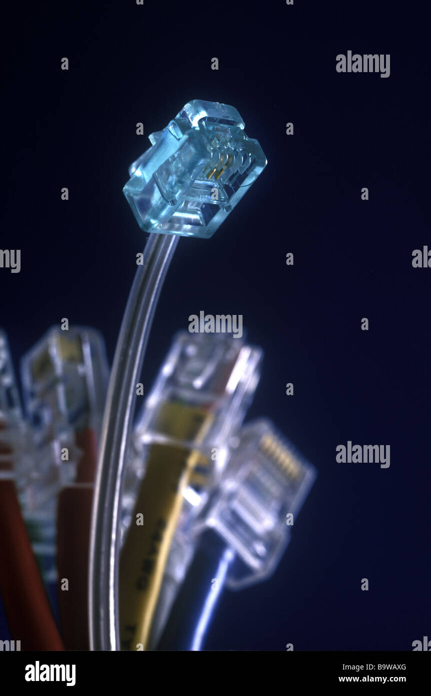 TELECOMMUNICATION COMPUTER CABLES ON PLAIN DARK BLUE BACKGROUND Stock ...