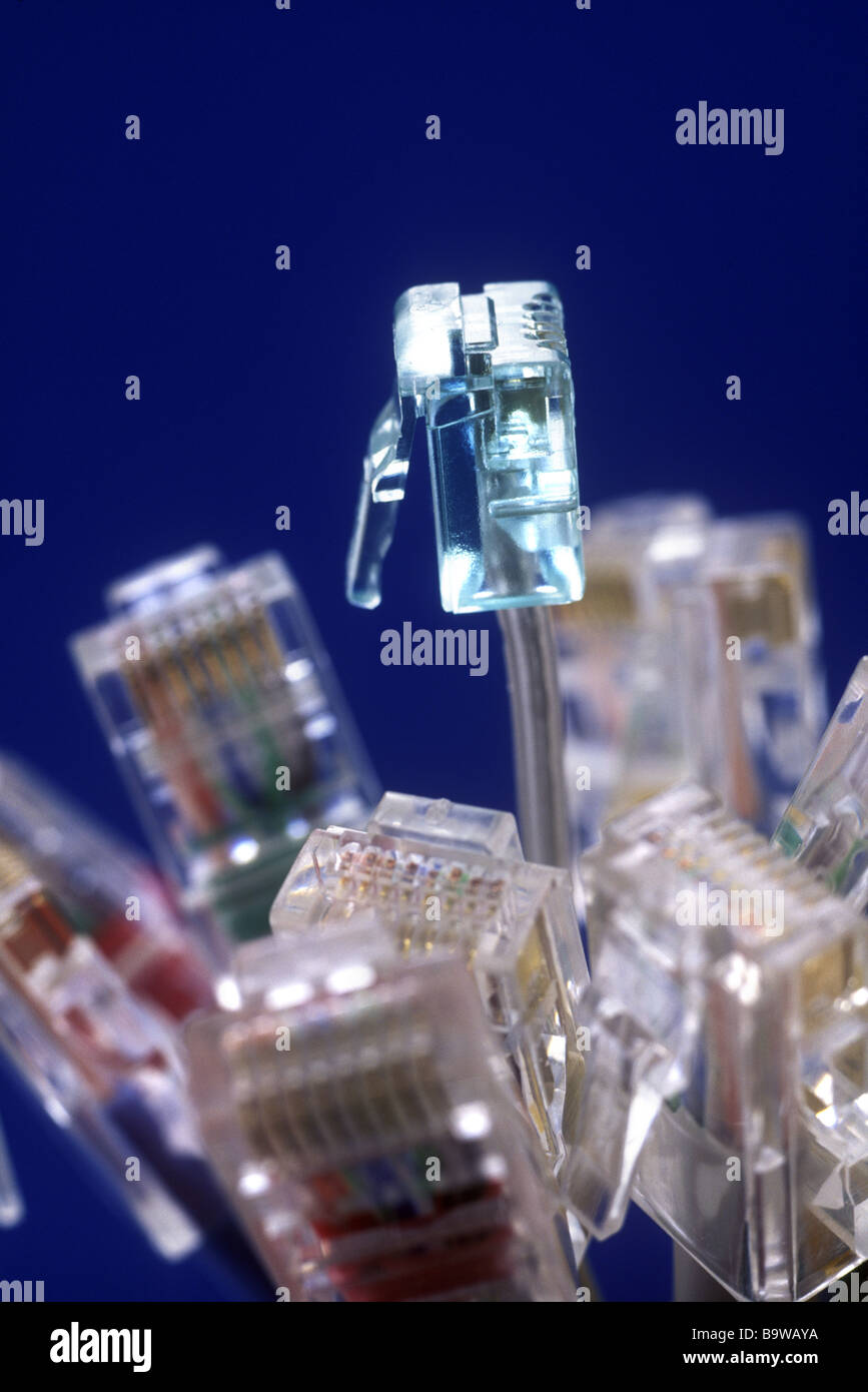 TELECOMMUNICATION COMPUTER CABLES ON PLAIN BLUE BACKGROUND Stock Photo ...