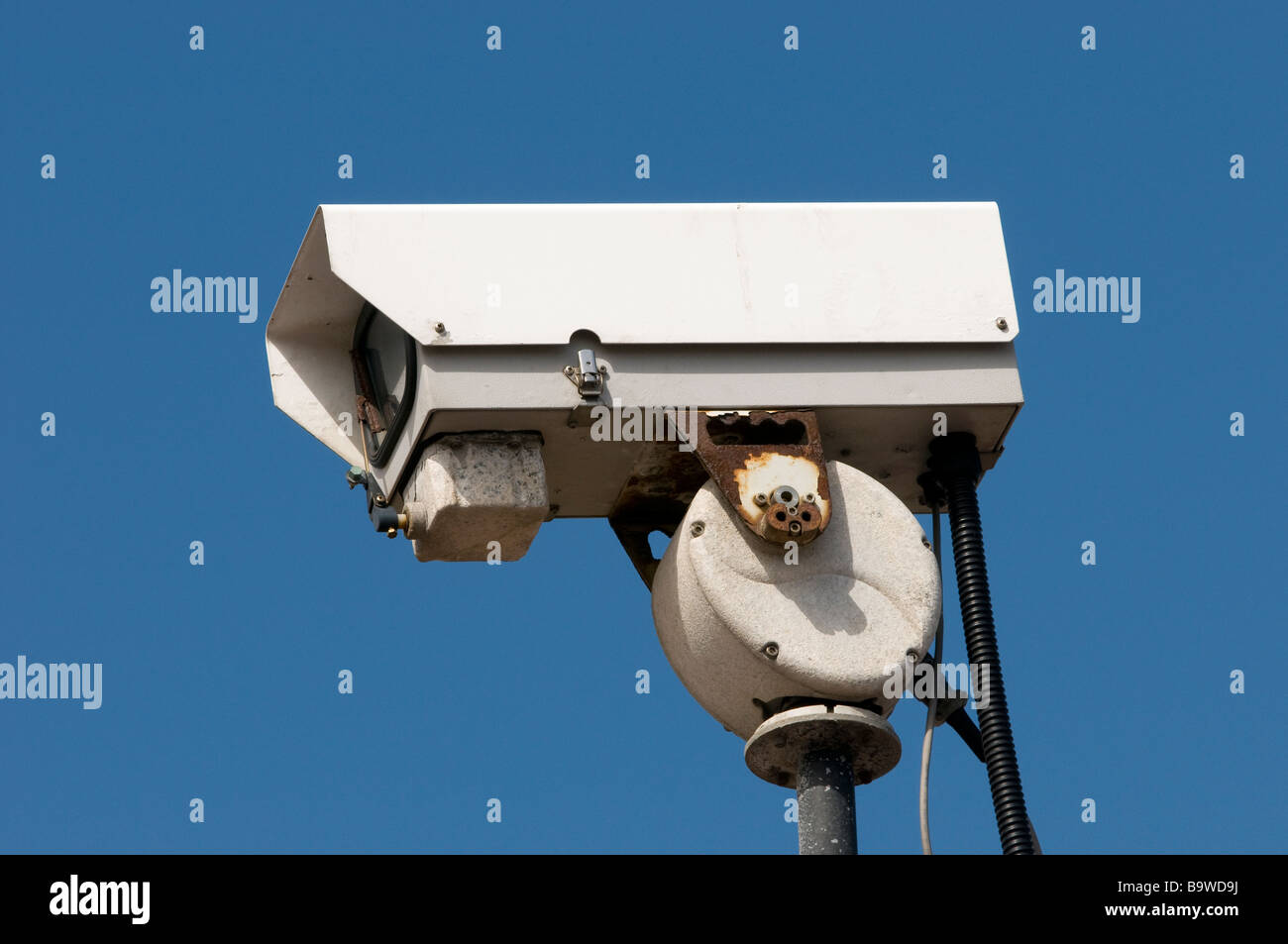 CCTV Camera against blue summer sky Stock Photo - Alamy