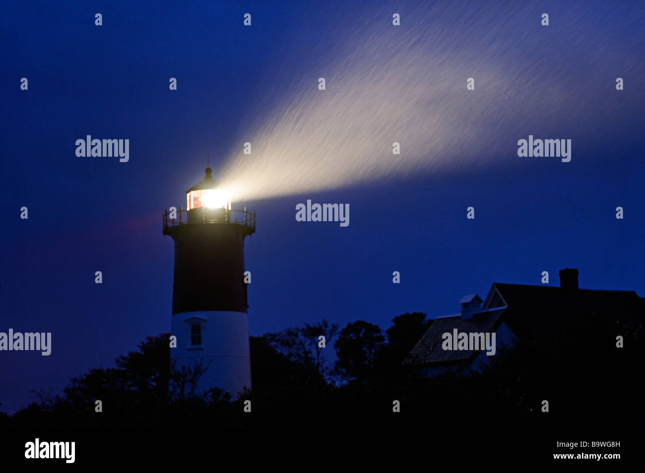 Nauset Light shines during a stormy night Cape Cod National Seashore ...