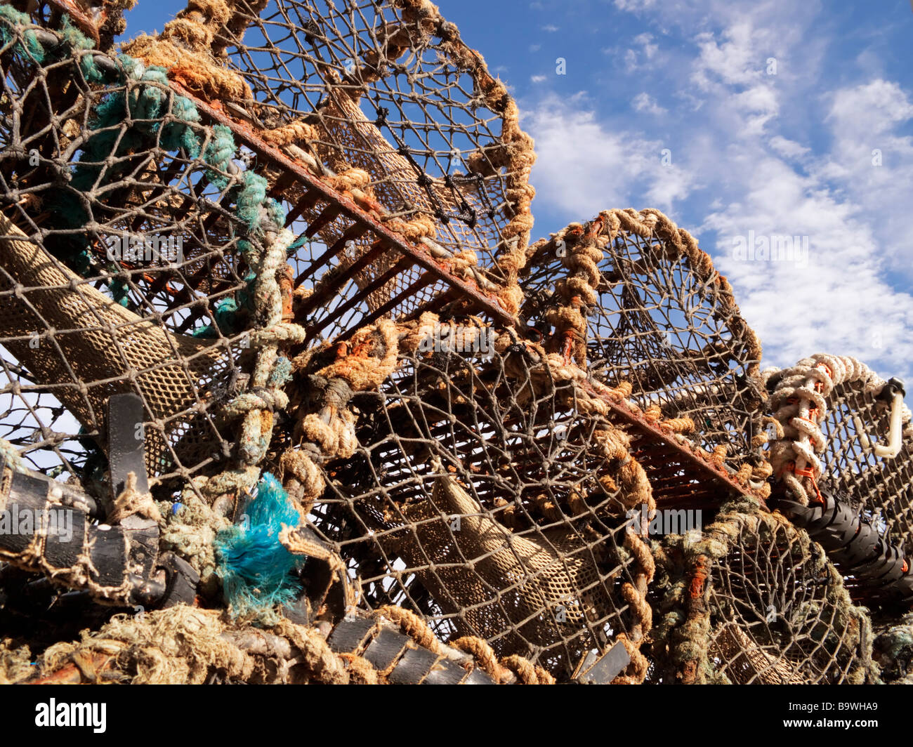 Stacked lobster pots on the quayside at Seahouses on the Northumberland ...