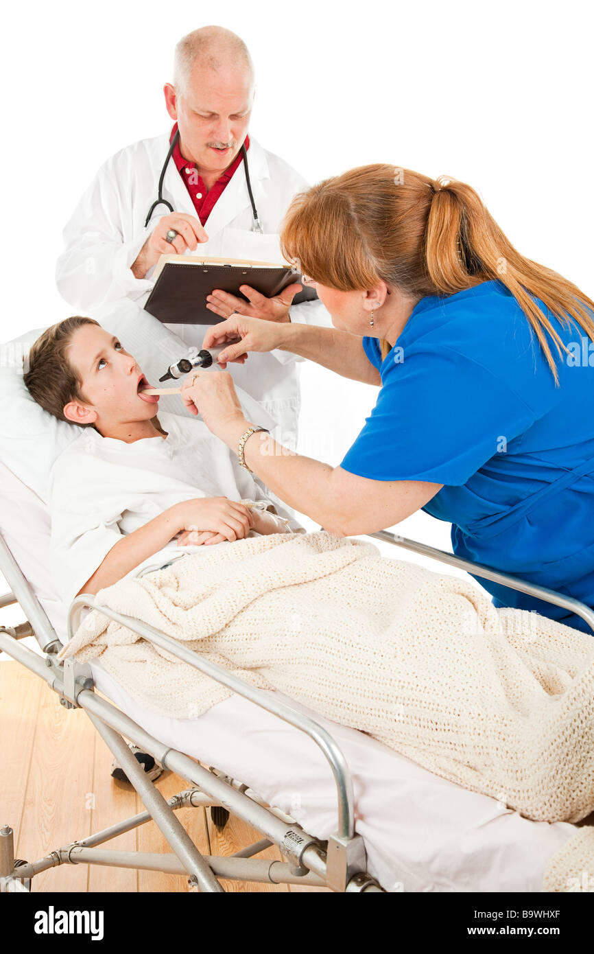 Little boy being treated by a doctor and nurse in a pediatric hospital ...