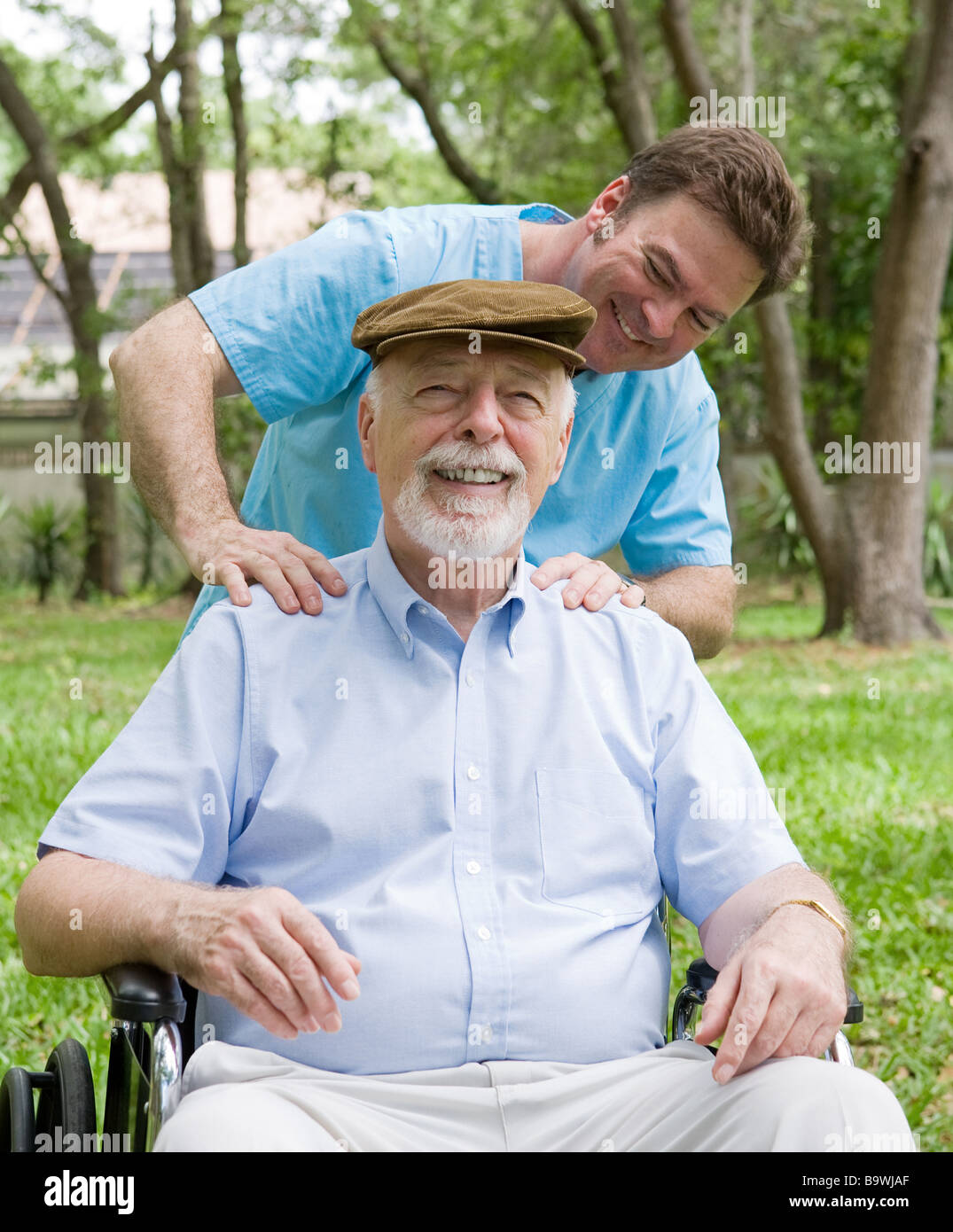 Disabled senior man enjoying a relaxing massage from his physical ...