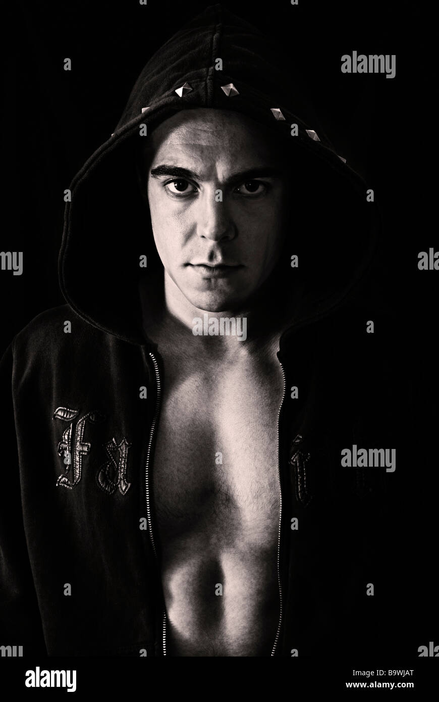 Well toned male model posing partially clothed Stock Photo - Alamy