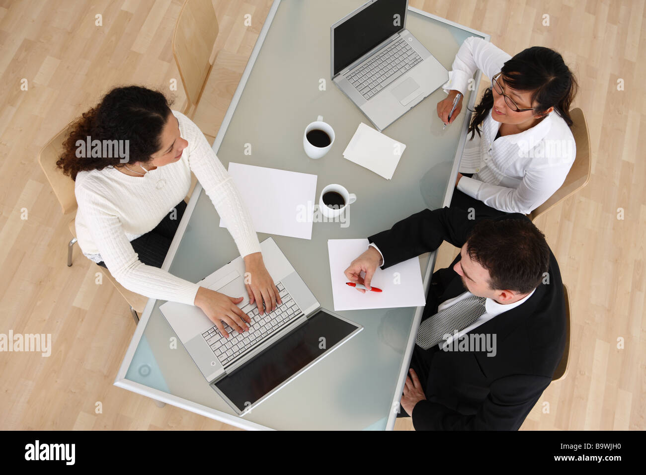 Overhead view of business meeting Stock Photo - Alamy