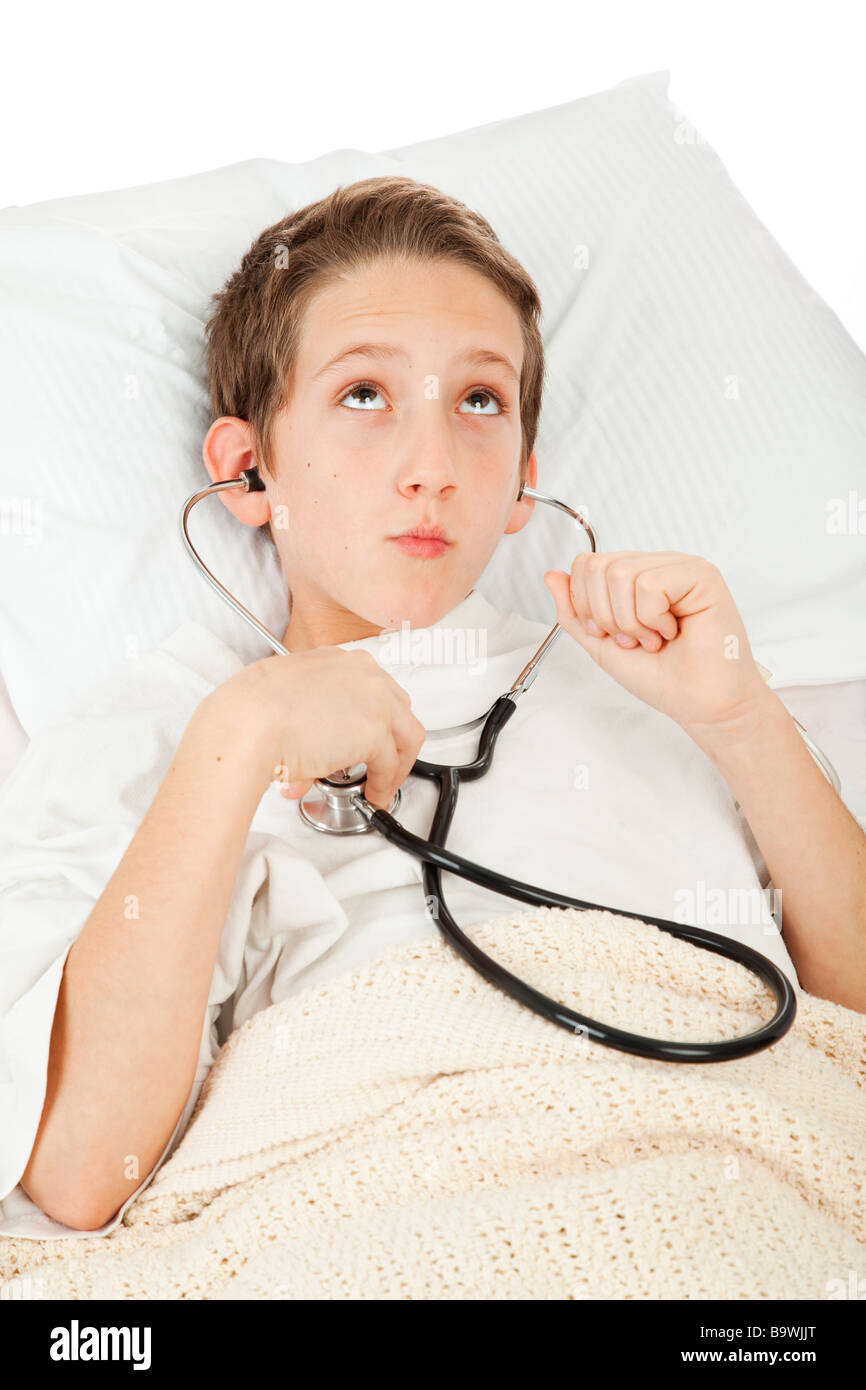 Cute little boy sick in the hospital listening to his heart with a ...